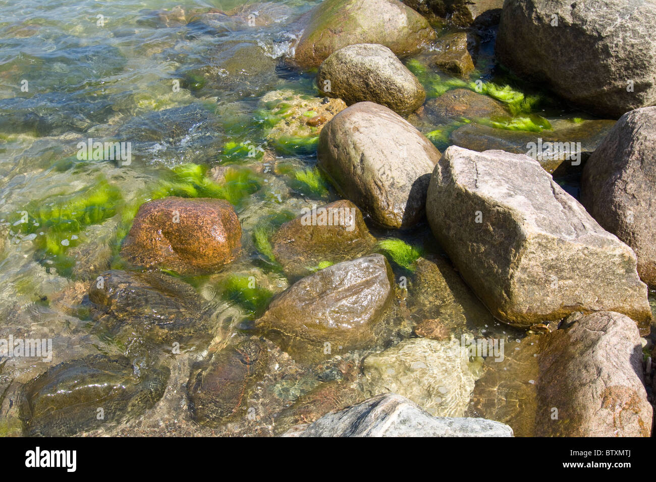 rocks in water Stock Photo - Alamy
