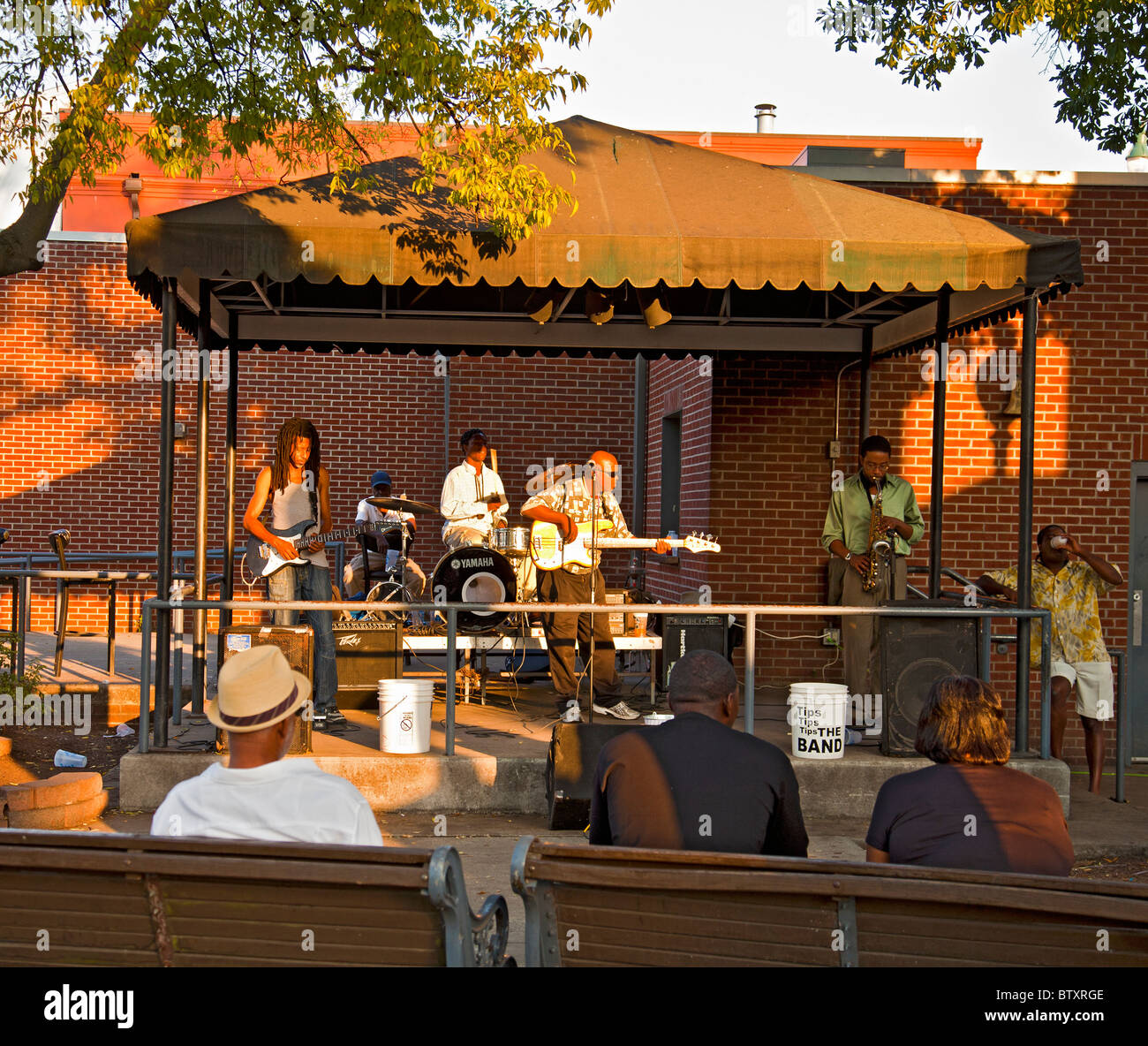People listening to a Band playing Blues Music in the Pepsi Cola ...