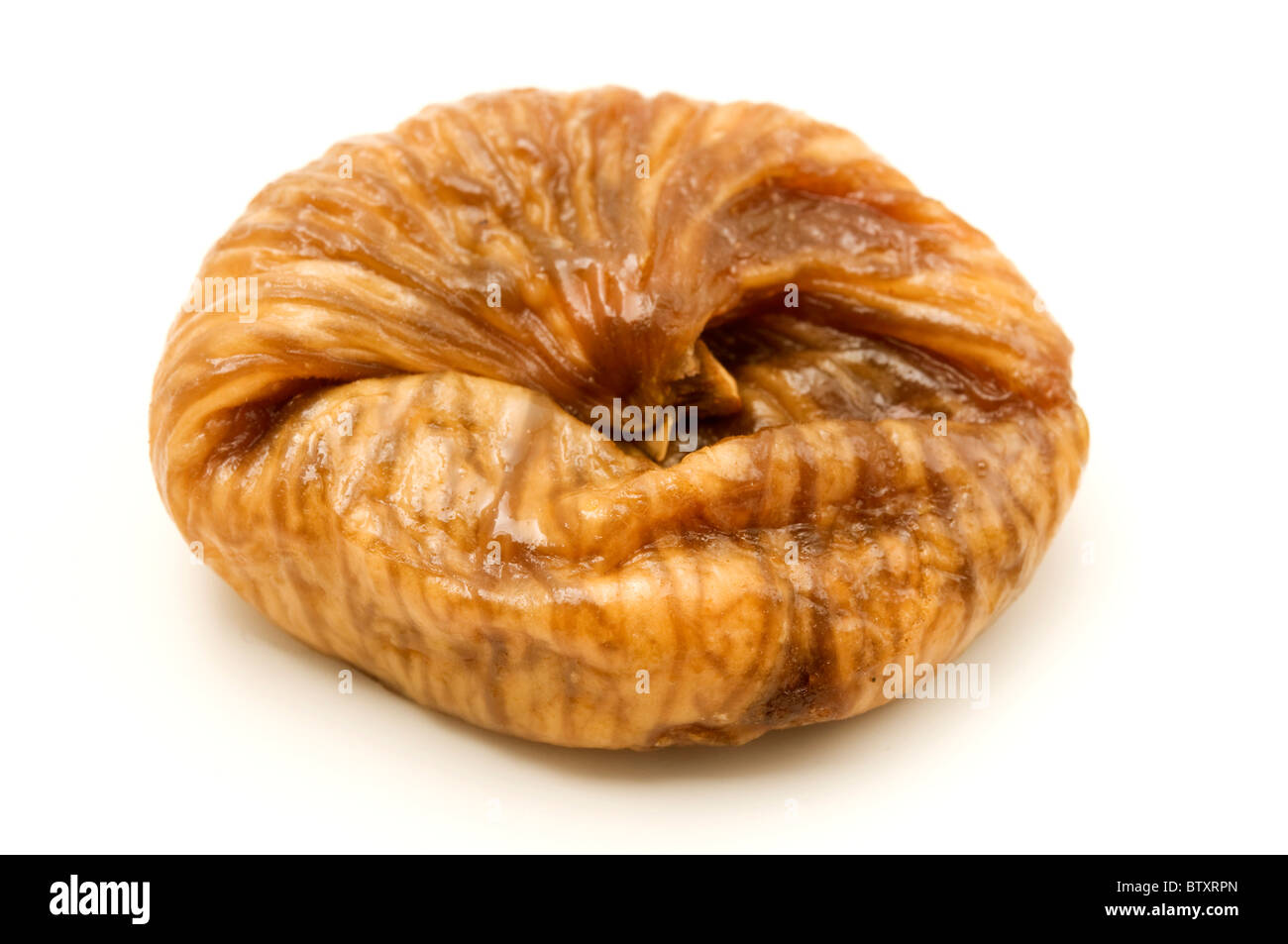 Dried fig on a white background Stock Photo - Alamy