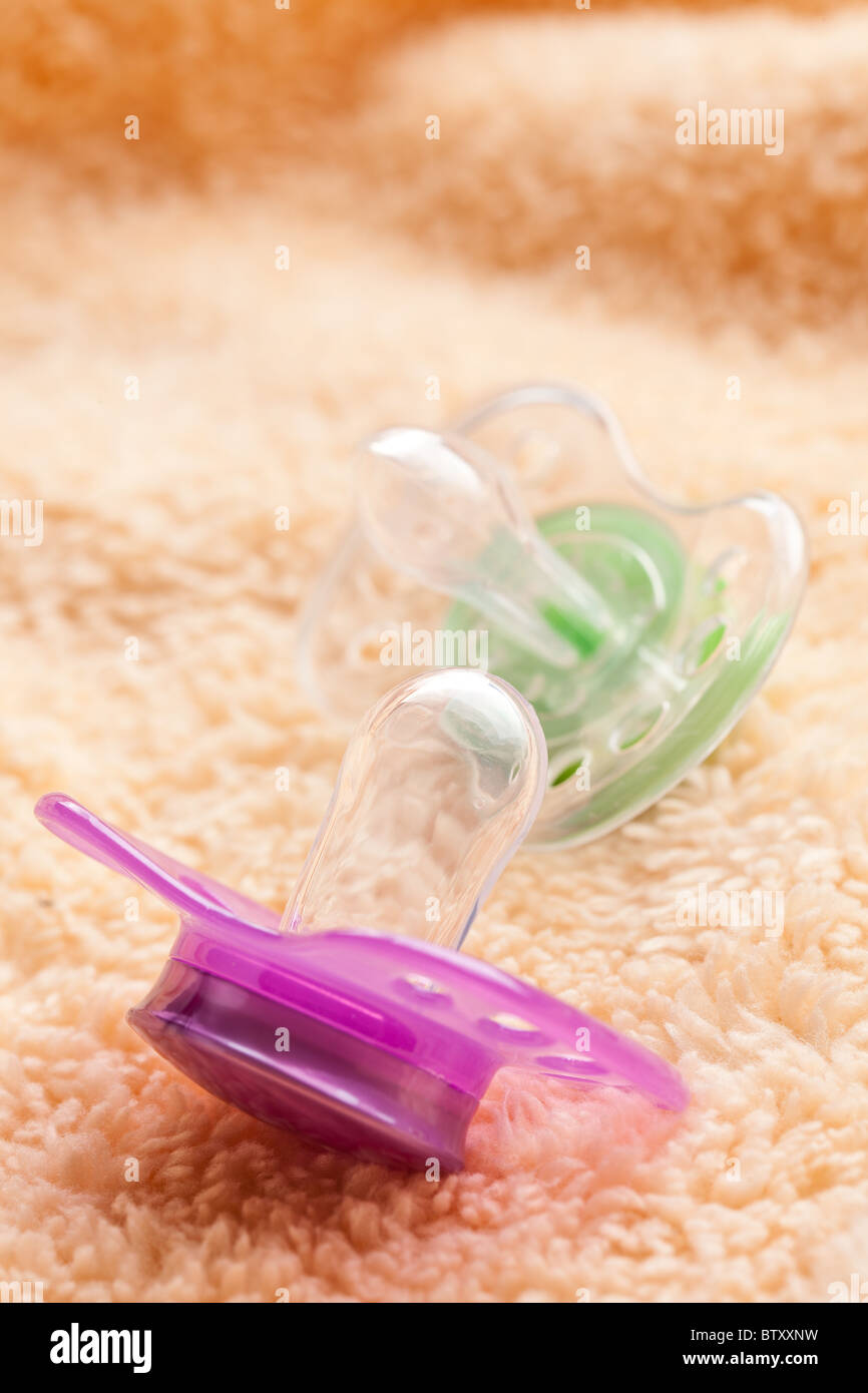 pacifier on soft background Stock Photo - Alamy