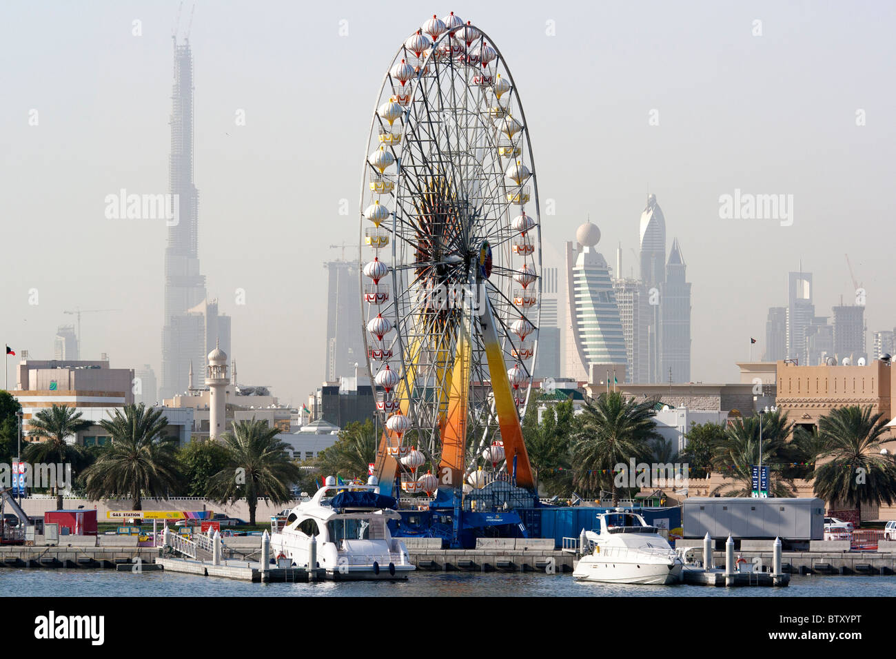 Dubai Creek and skyline- with carousel Stock Photo - Alamy