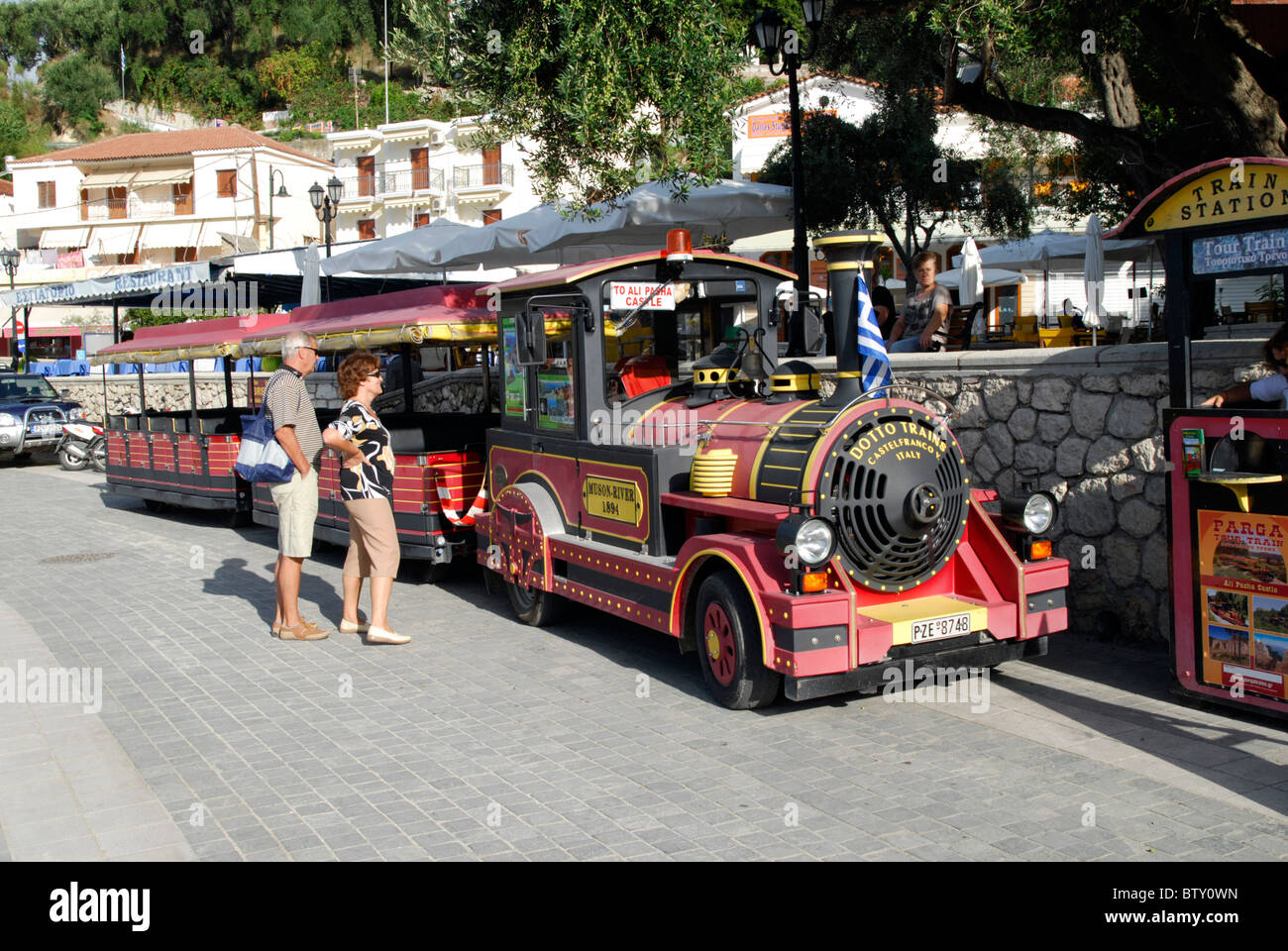 Two Tourists and Tourist Train in Parga, Greece Stock Photo - Alamy
