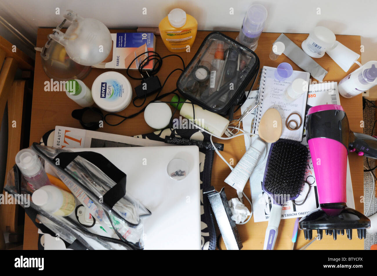 Messy girl's bedroom, clothes strewn on floor Stock Photo - Alamy