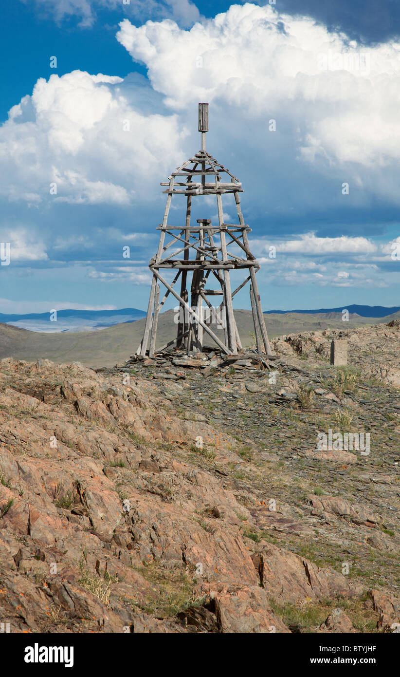 Wooden geodesic tower on a mountaintop shows the height above the level ...