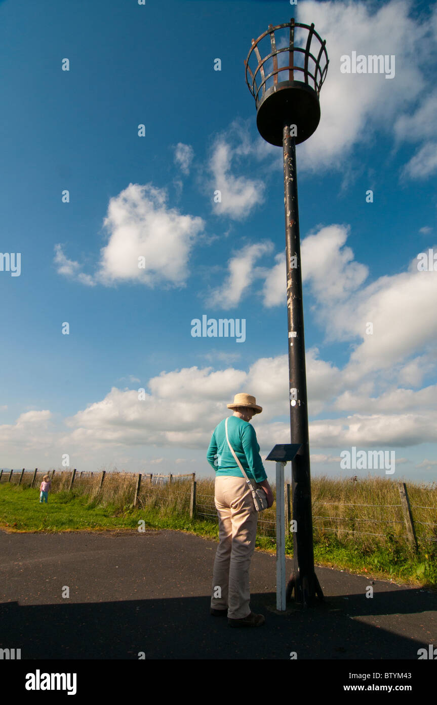 Woman reading information plaque for the Carter Bar Beacon at the ...