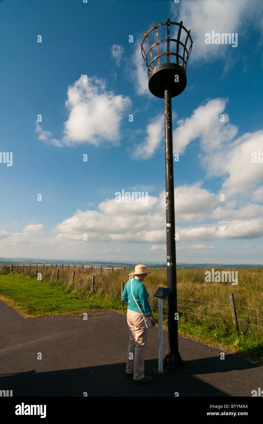Woman reading information plaque for the Carter Bar Beacon at the ...