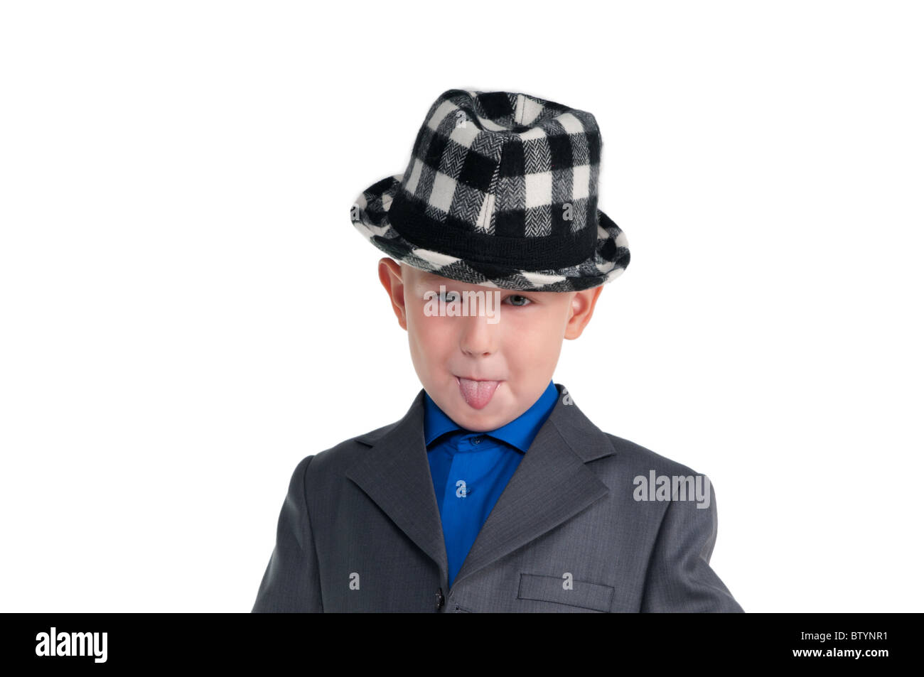 Small schoolboy with suit and hat making faces Stock Photo - Alamy