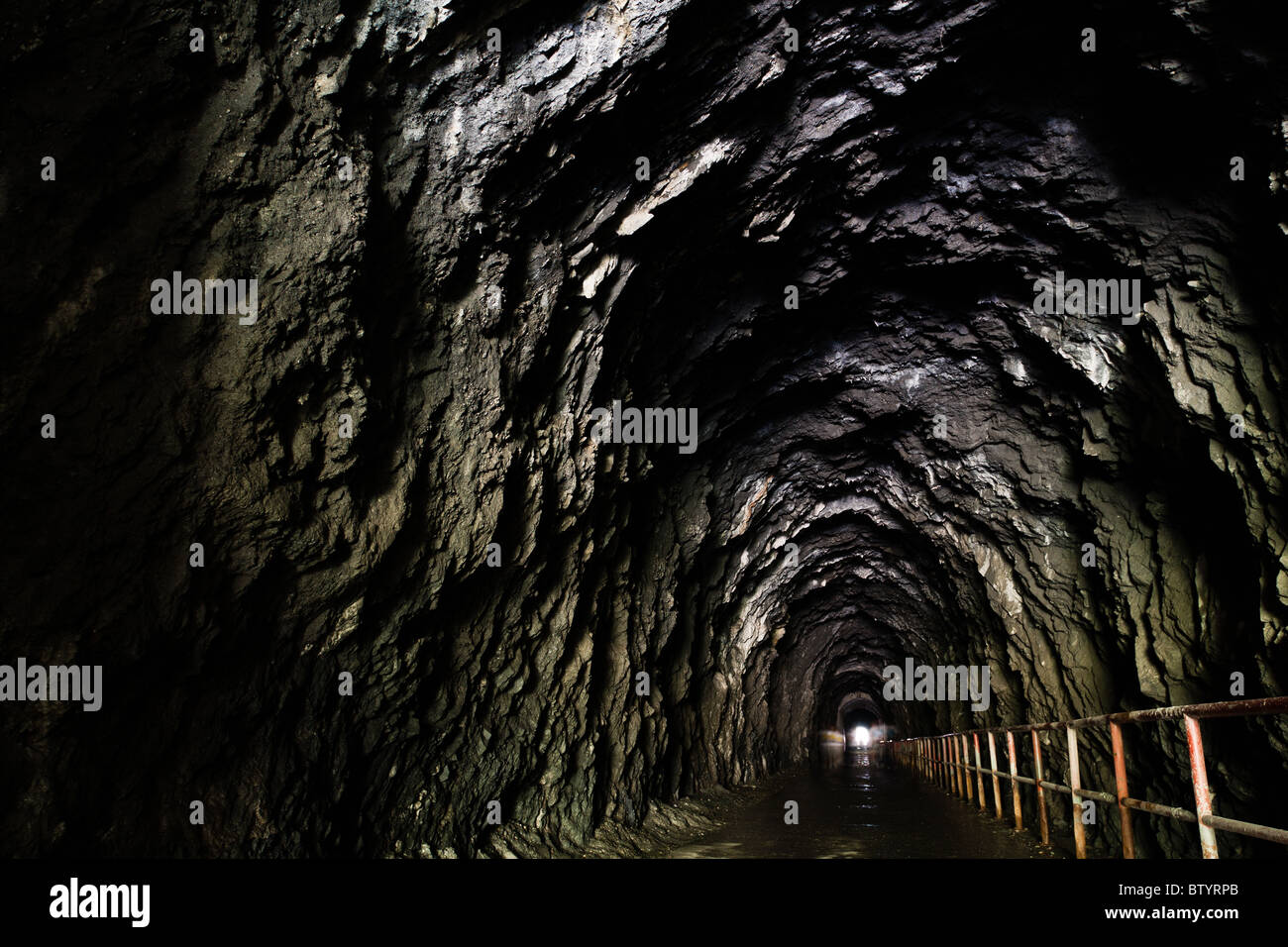 Baiyang Trail Tunnel No. 1, rocky tunnel interior view, light at the ...