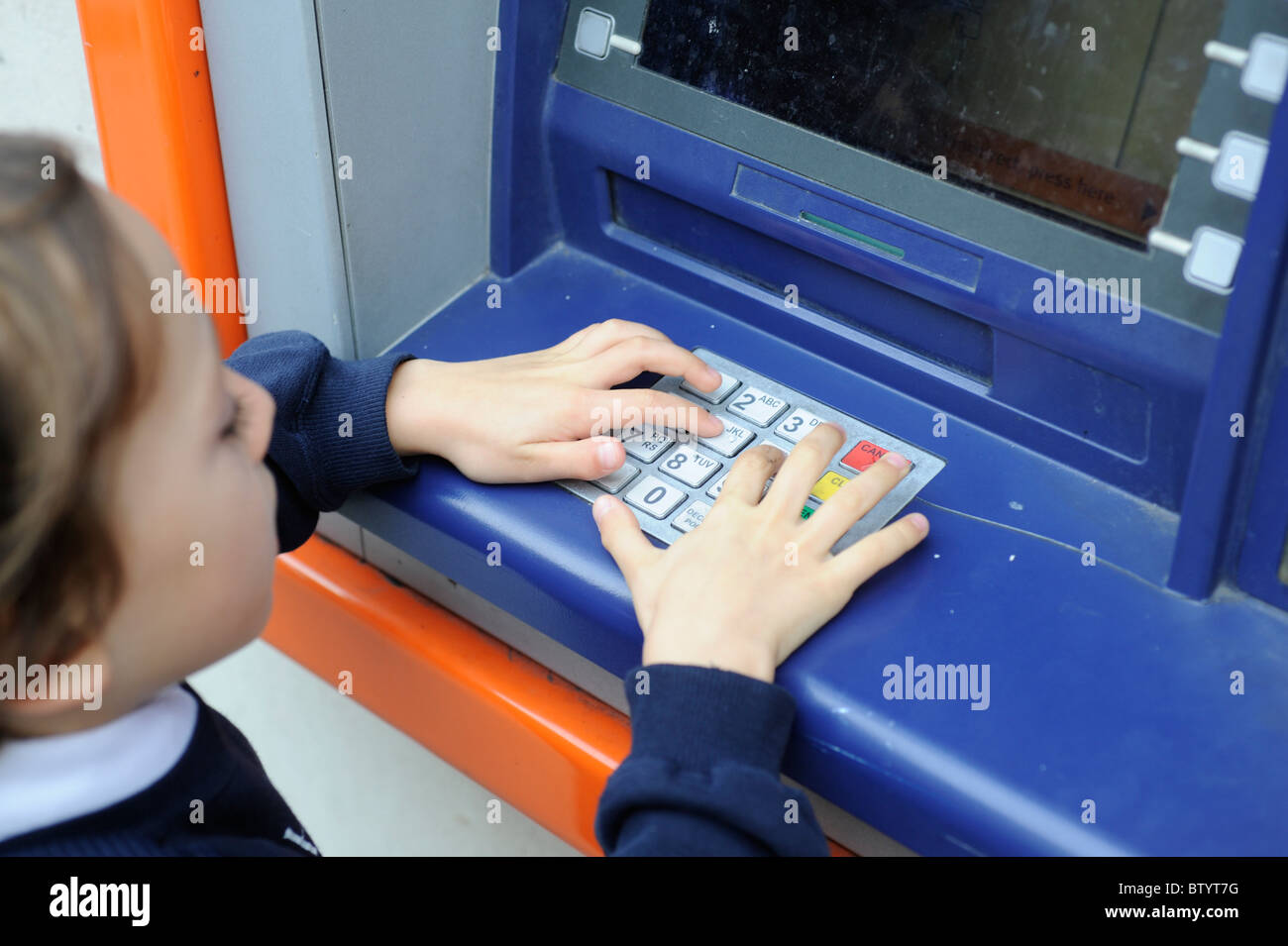 Boy At A Cash Machine High Resolution Stock Photography and Images - Alamy