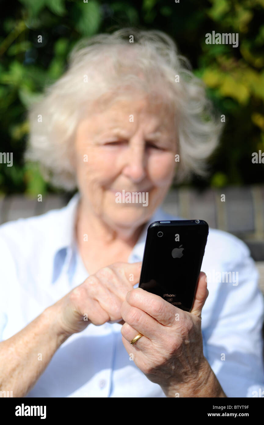 Old lady learning mobile phone hi-res stock photography and images - Alamy