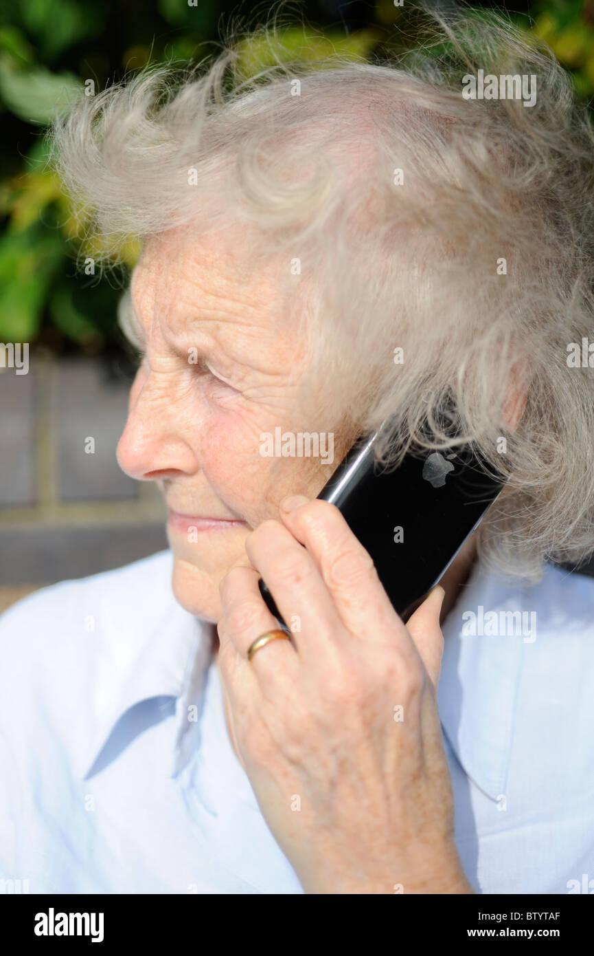 elderly lady using iphone Stock Photo - Alamy