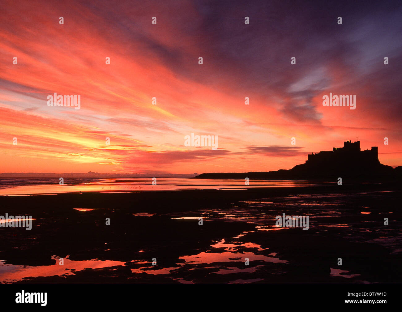 Bamburgh Castle at Sunrise Stock Photo - Alamy