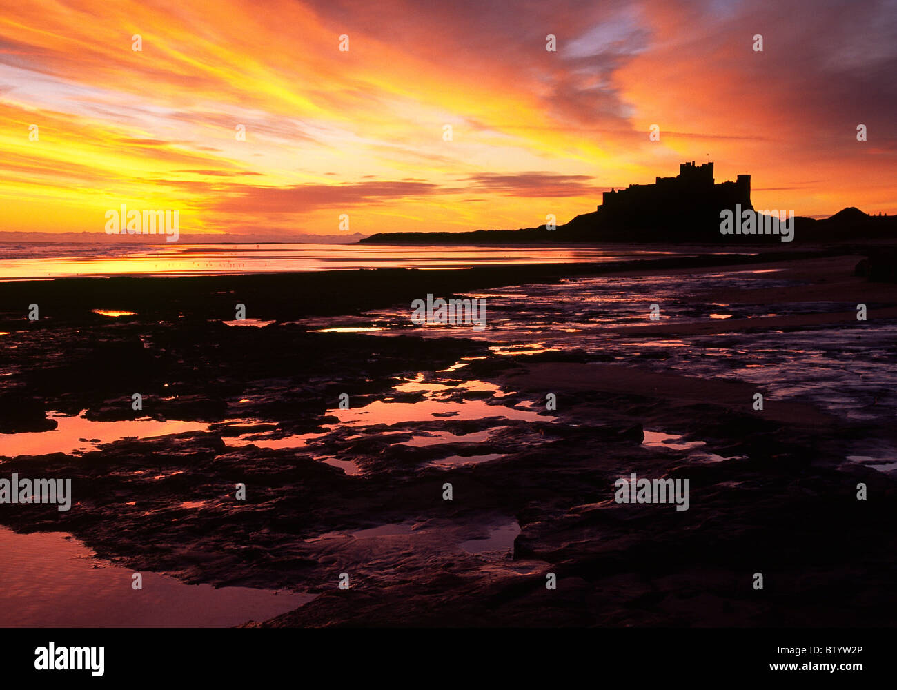 Bamburgh Castle at Sunrise Stock Photo - Alamy