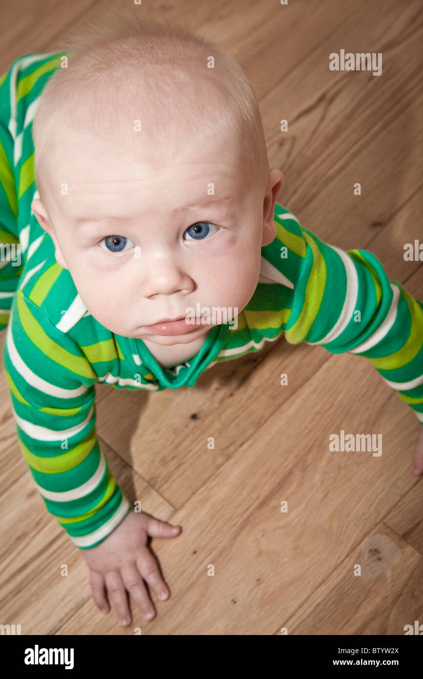 Baby crawling on the floor Stock Photo - Alamy