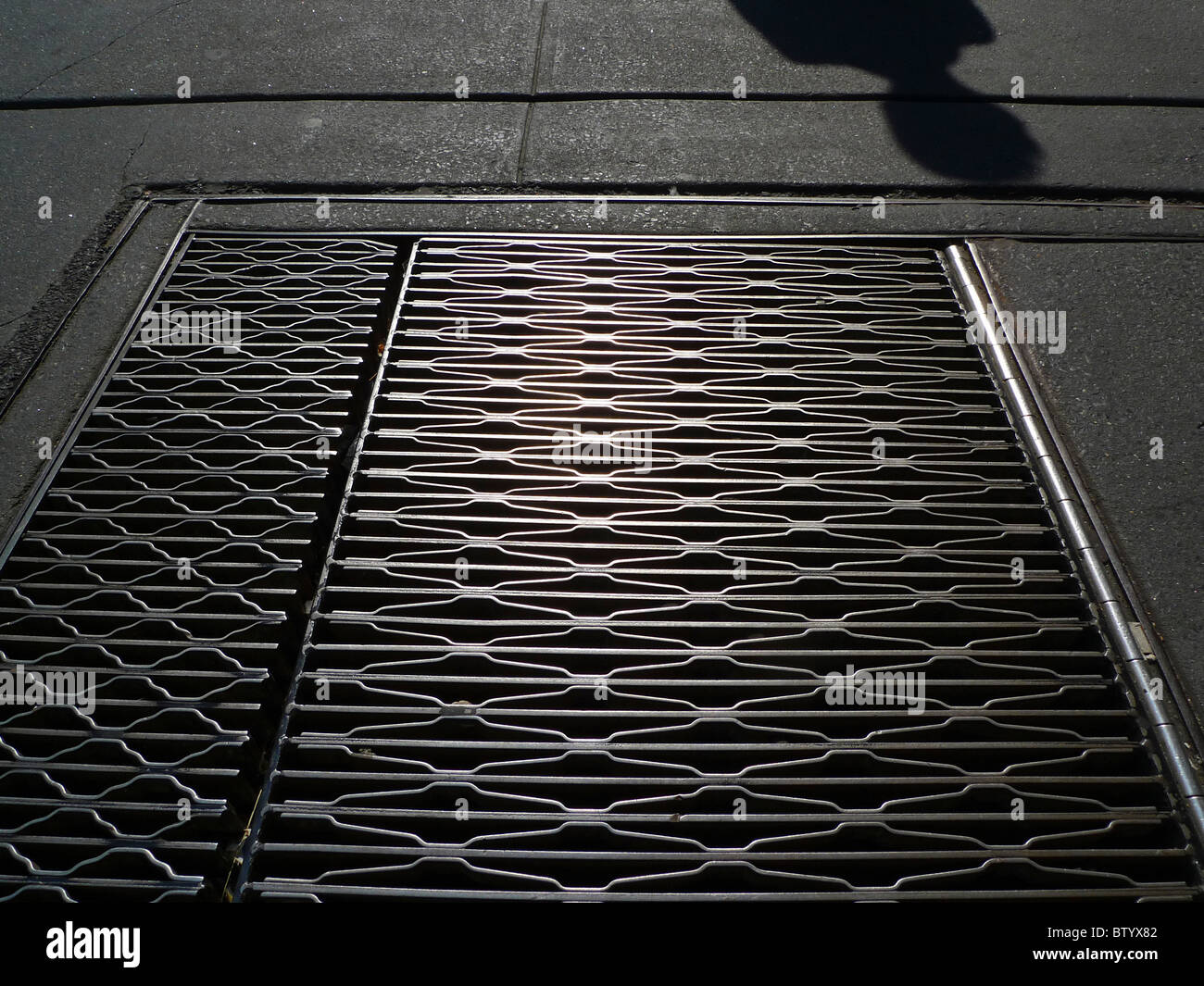 A New York street sidewalk with a single shadow Stock Photo - Alamy