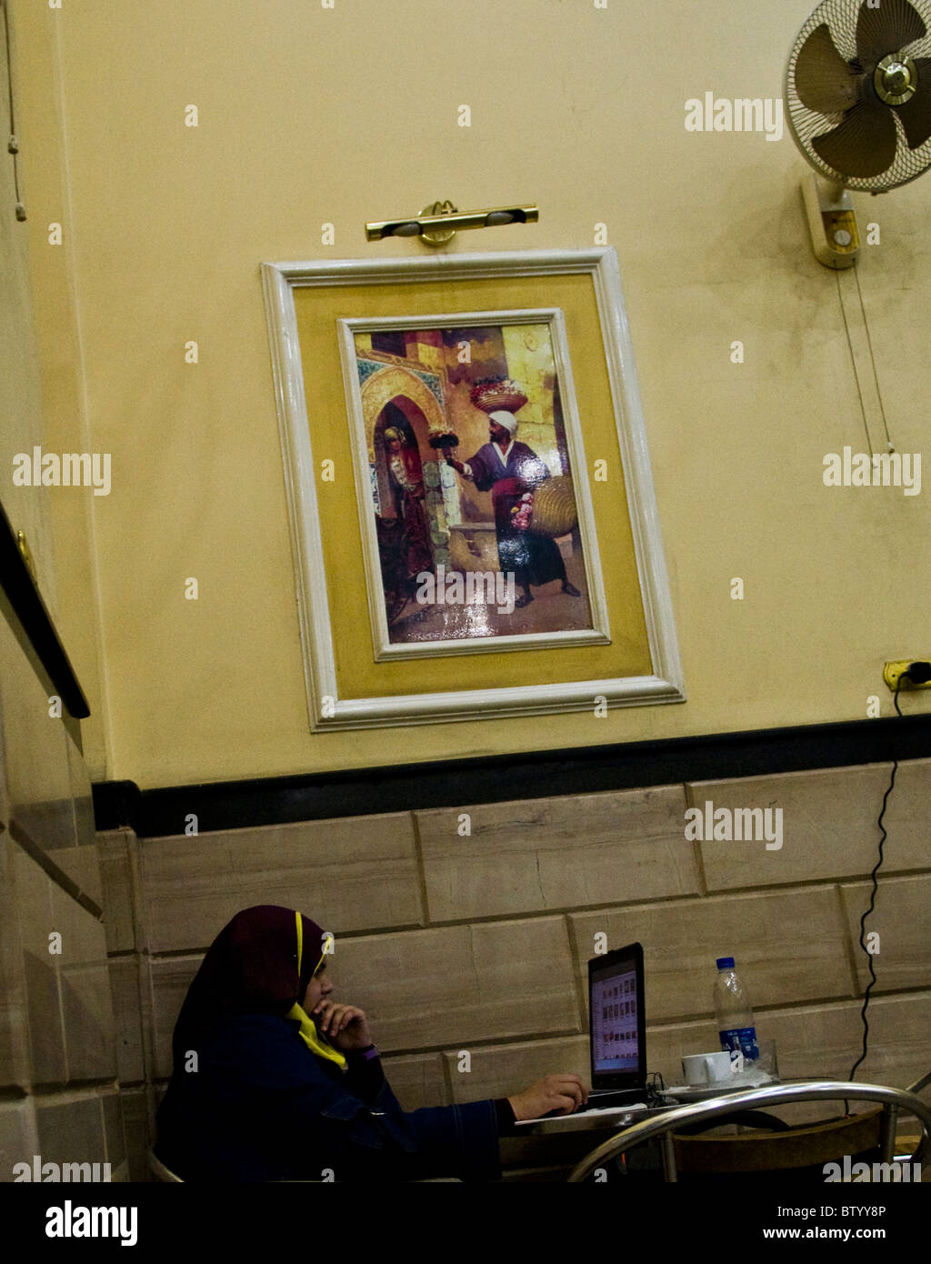 Working on her laptop computer at Cairo's railway station Stock Photo ...