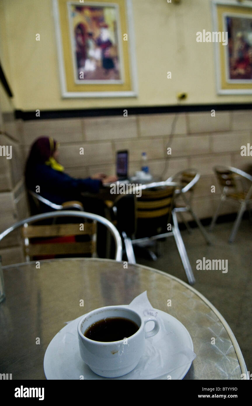 Working on her laptop computer at Cairo's railway station Stock Photo ...
