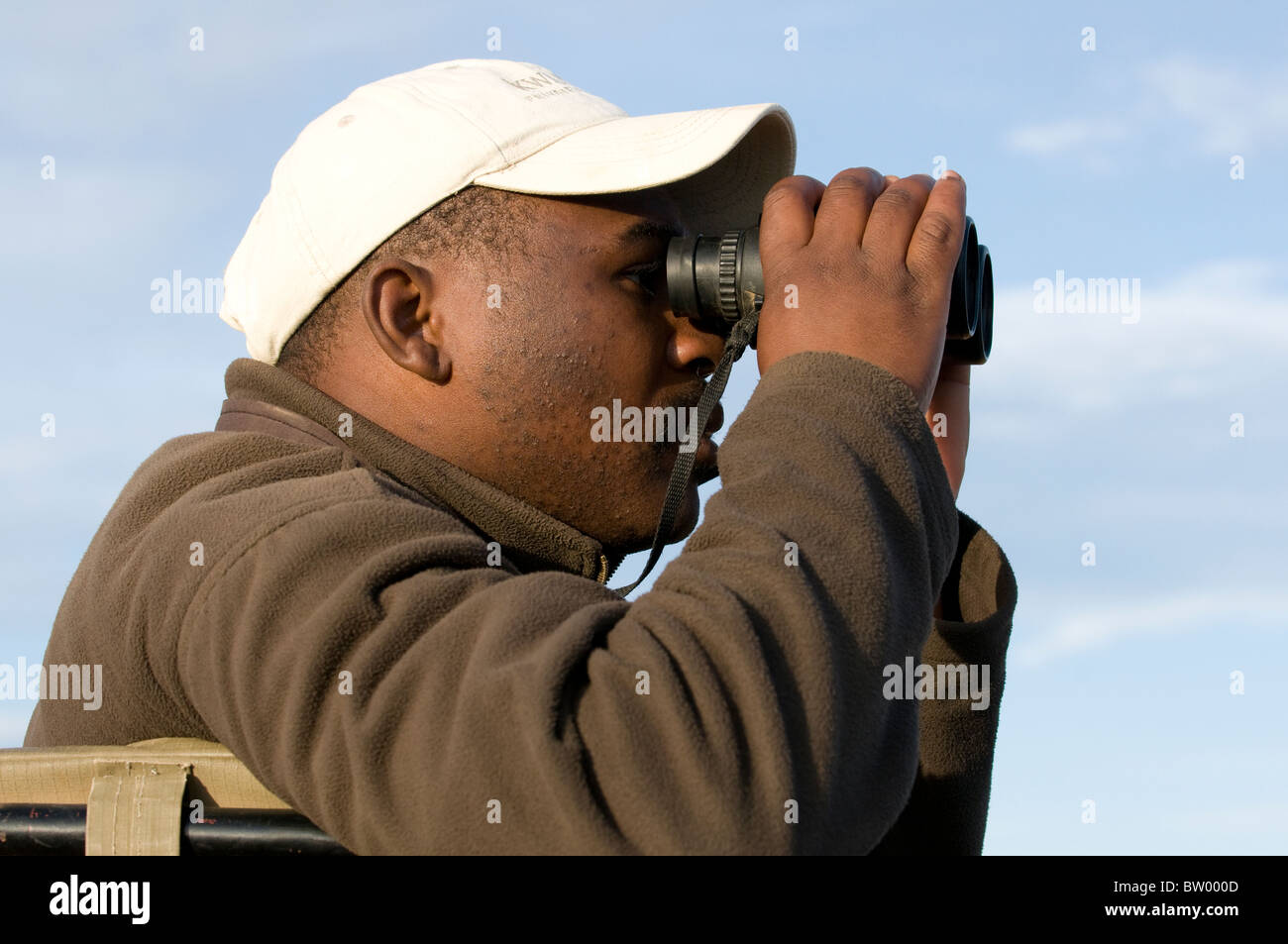 People looking through binoculars, Kwandwe Game Reserve, Eastern Cape ...