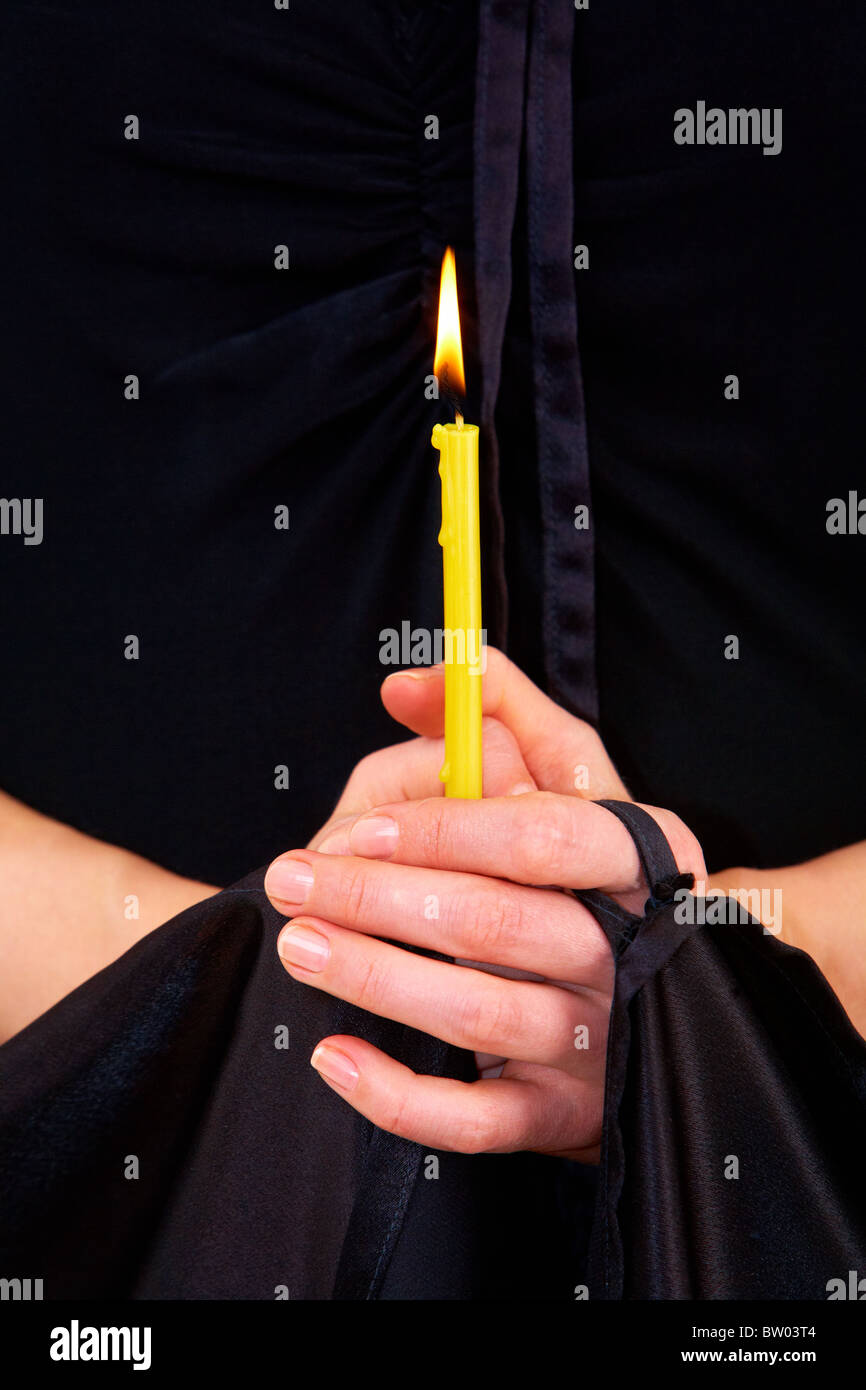 Image of burning candle in human hands Stock Photo - Alamy