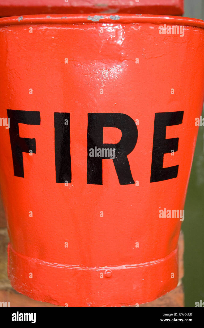 Red fire bucket Stock Photo - Alamy
