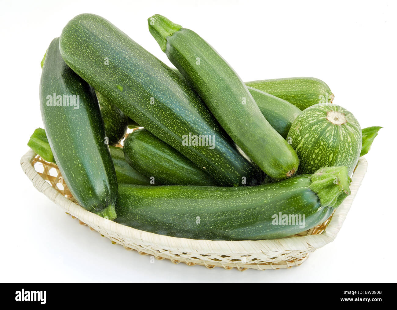 Fresh small green vegetable marrows in a wattled small basket Stock ...