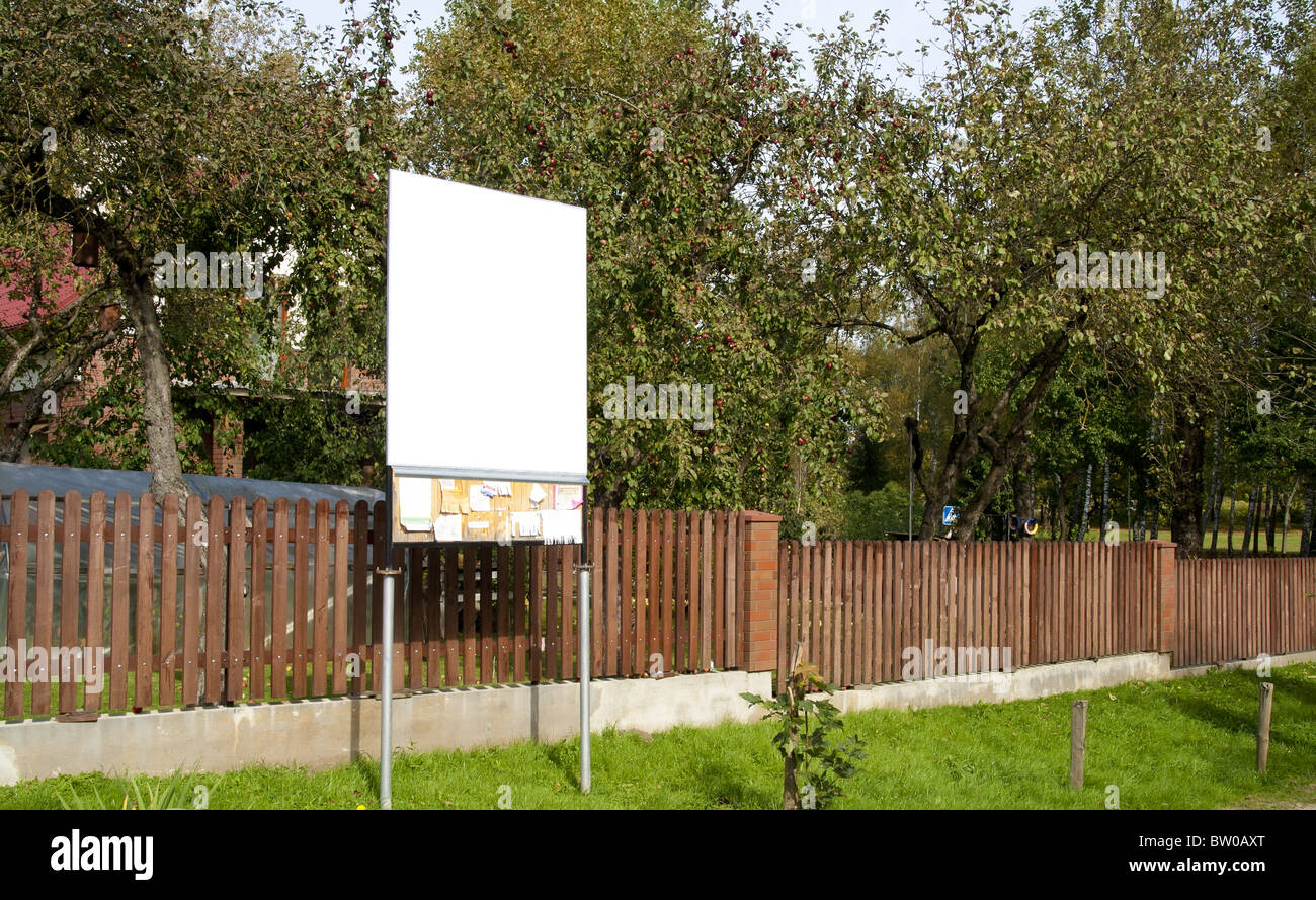 Pure bulletin billboard near an apple garden Stock Photo - Alamy