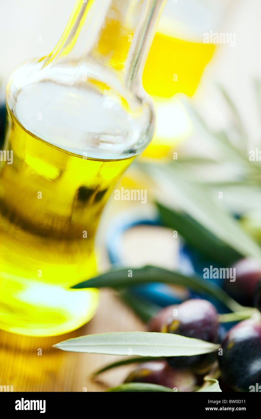 olive oil on wooden table Stock Photo - Alamy