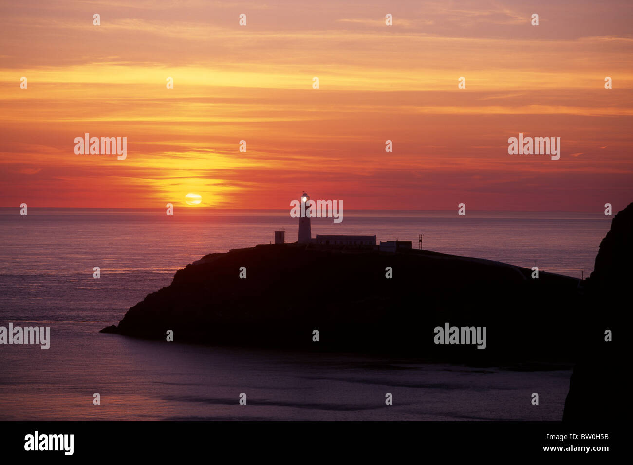 South Stack lighthouse at sunset Near Holyhead Anglesey North Wales UK ...