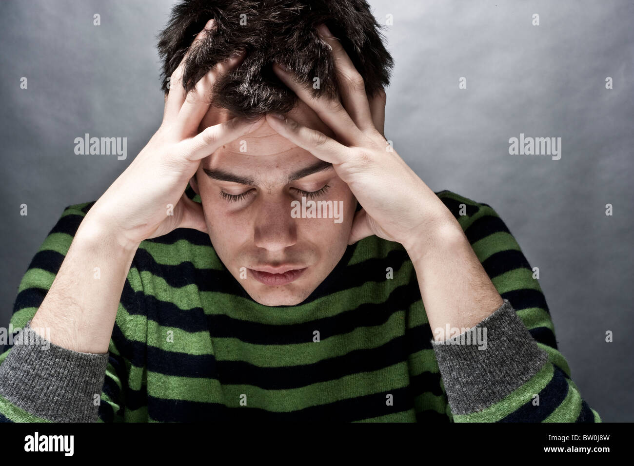portrait of young sad male Stock Photo - Alamy