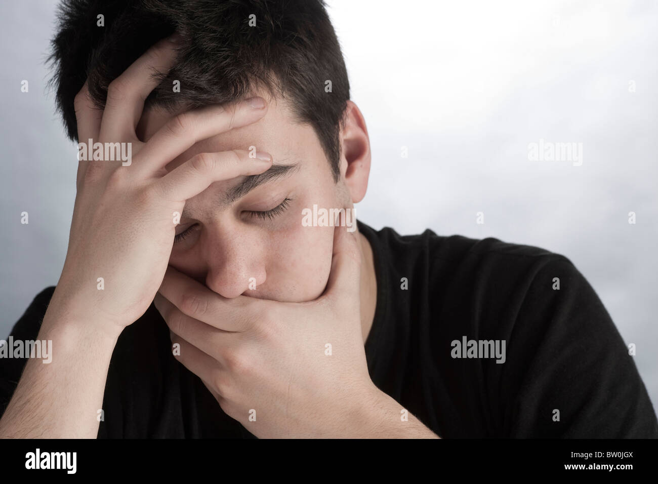 portrait of young sad male Stock Photo - Alamy