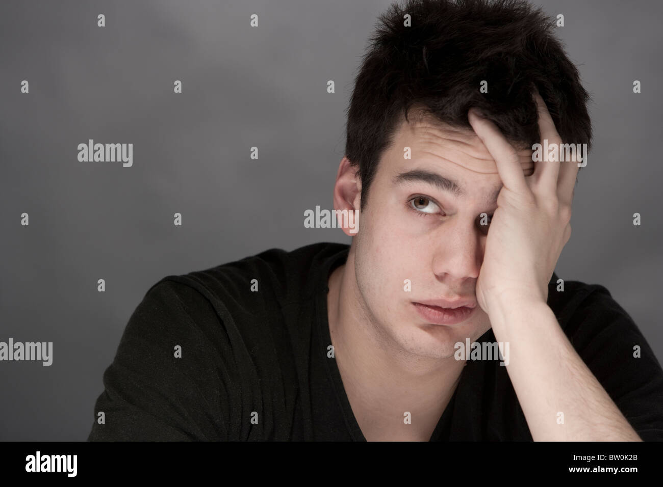 portrait of young sad male Stock Photo - Alamy