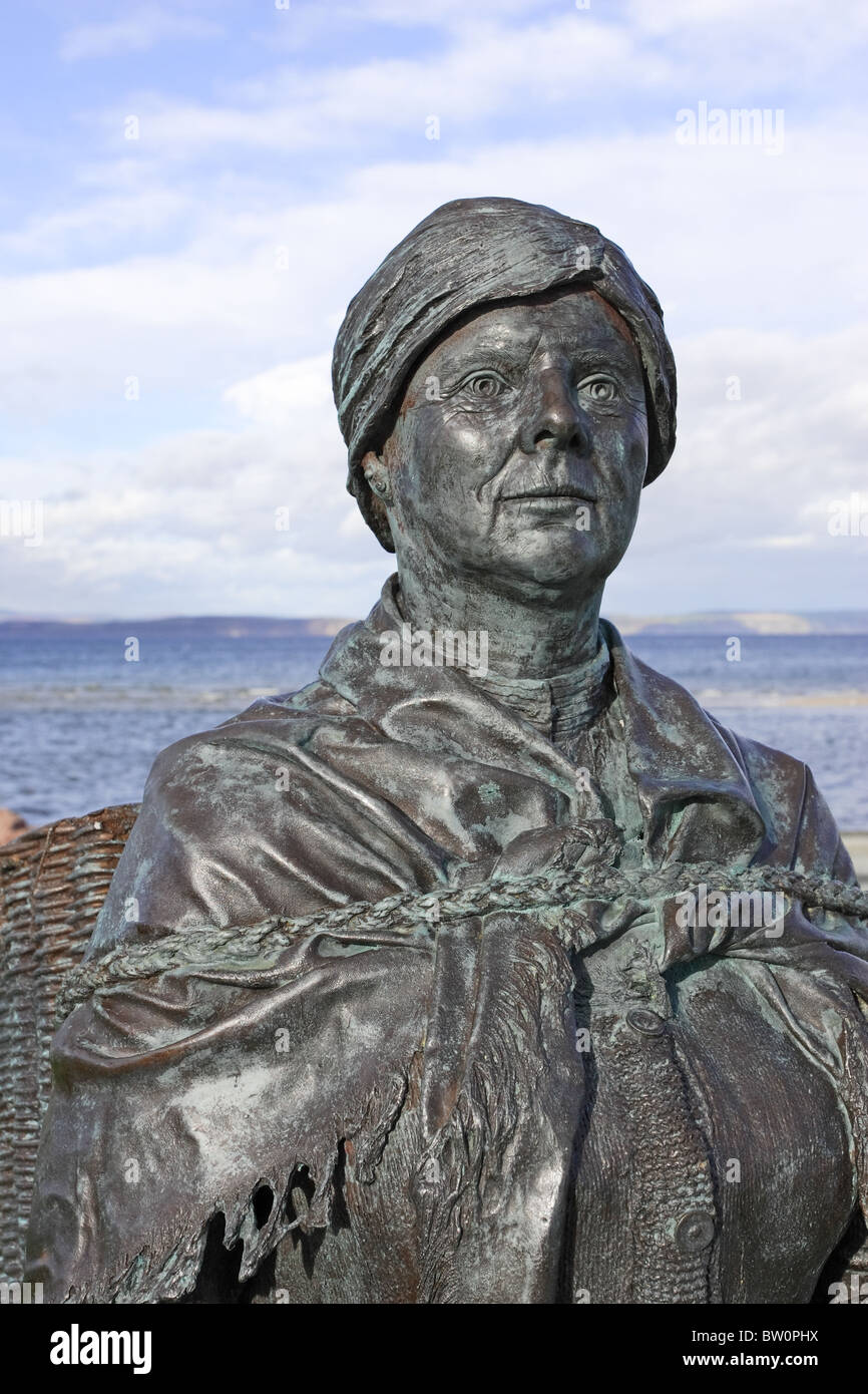 A bronze statue of a 'fishwife' on the harbour in Nairn, Scotland ...