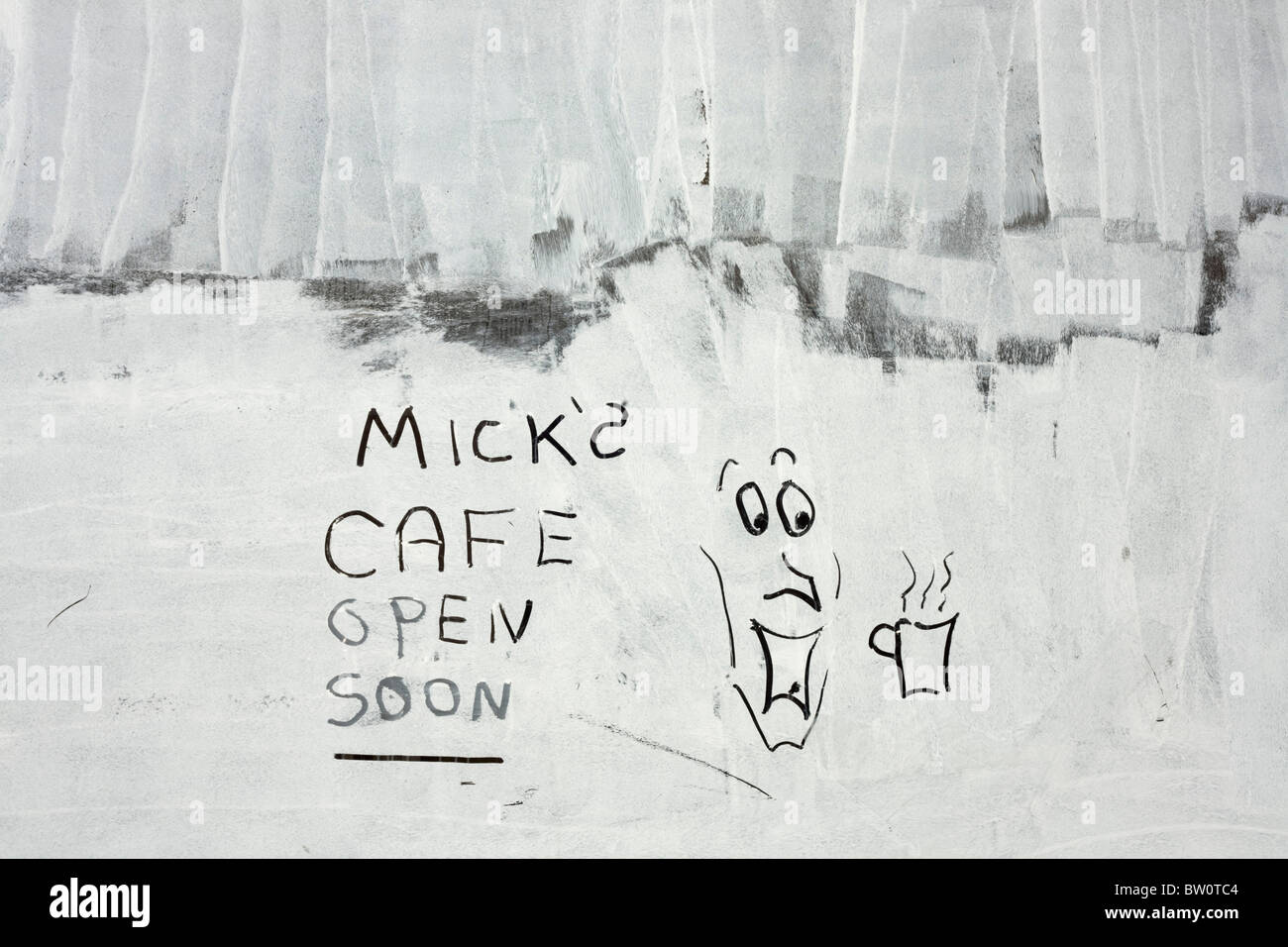 A cartoon picture and re-opening writing have been drawn in white ...