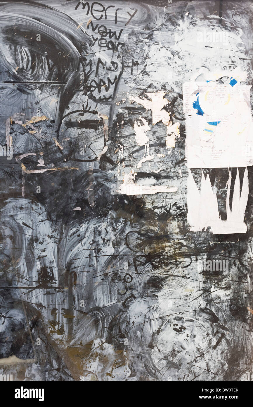 Smeared emulsion and commercial paper stuck to a window of an East ...