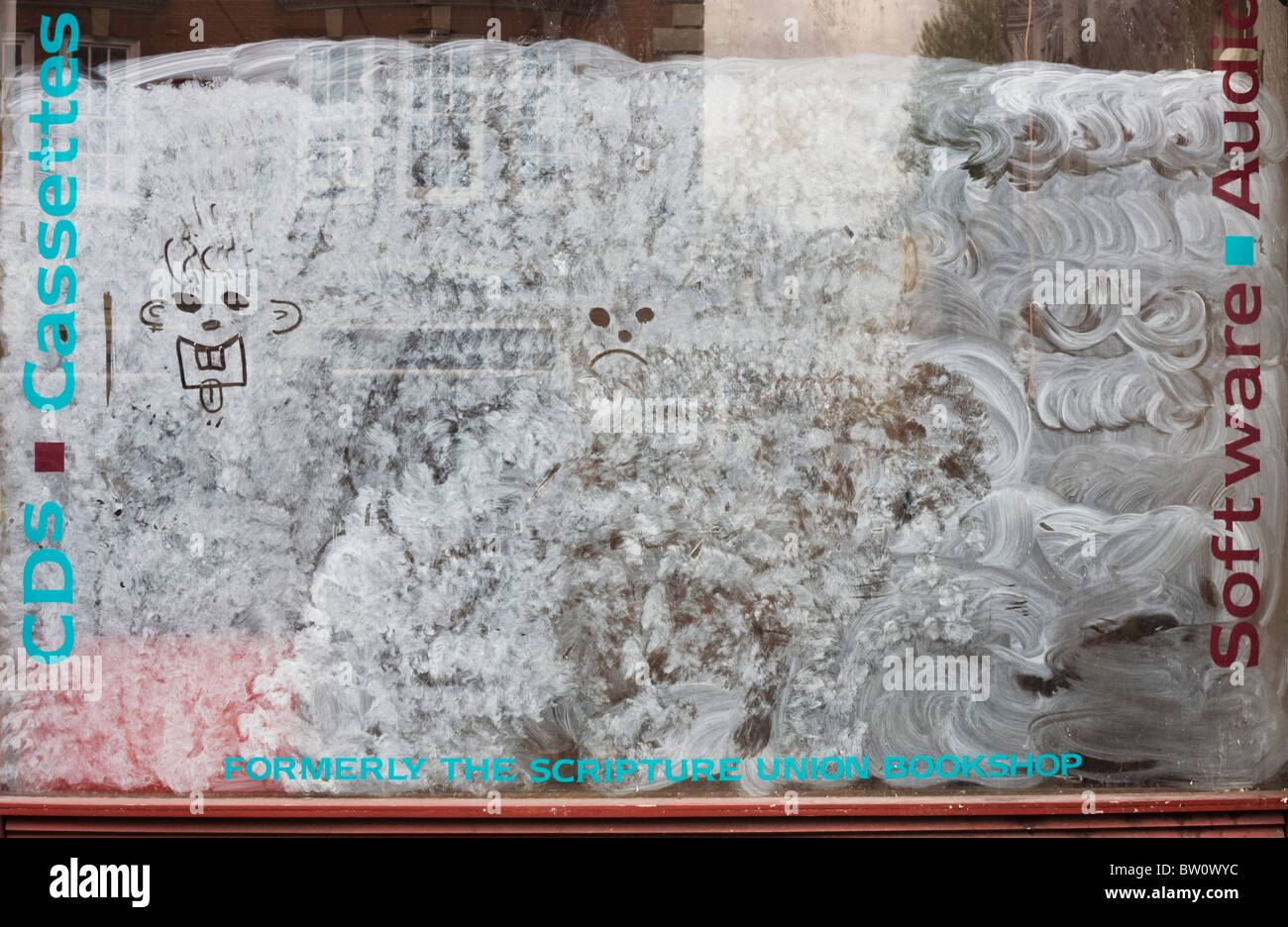 White emulsion paint smeared over the words CD and cassettes in the ...