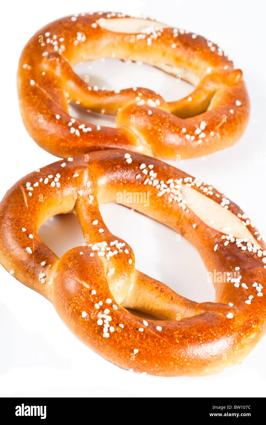 two pretzels on a white background Stock Photo - Alamy