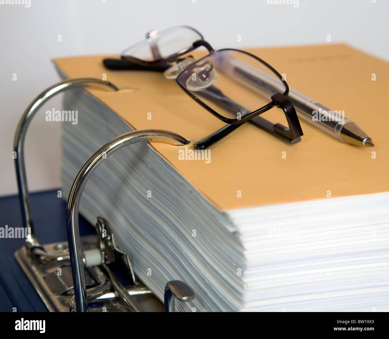Documents of finance with pen and glasses Stock Photo - Alamy