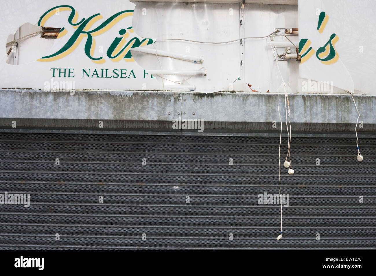 Shattered shop sign and light fittings in a shopping precinct, a victim ...