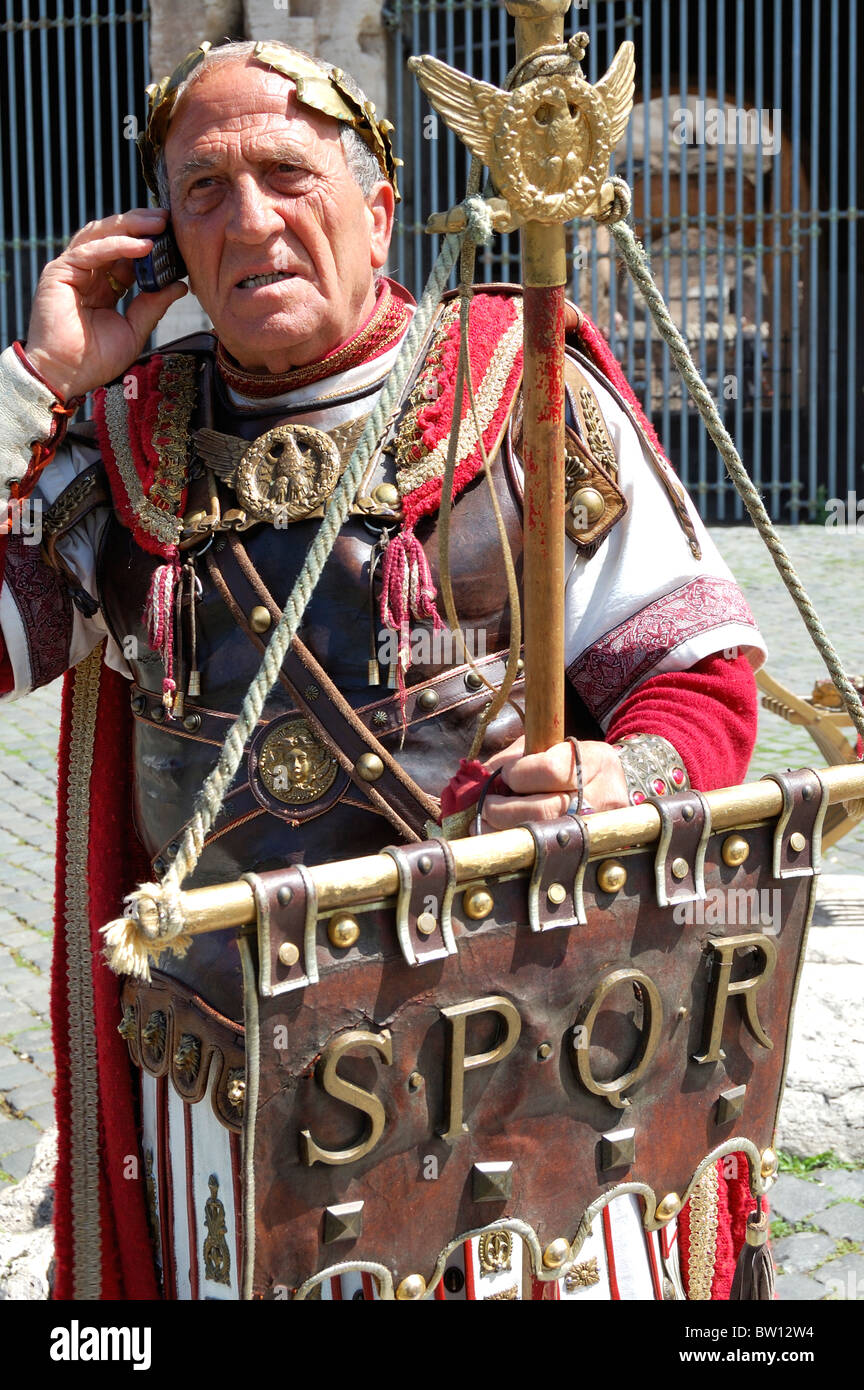 Gladiator performer on phone, Colosseum Stock Photo - Alamy
