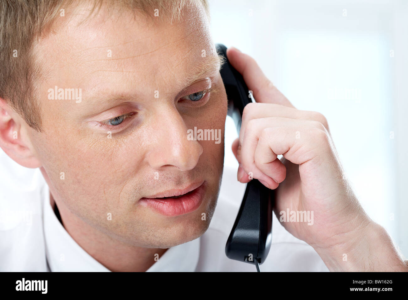 Photo of smart businessman calling somebody on the telephone Stock ...