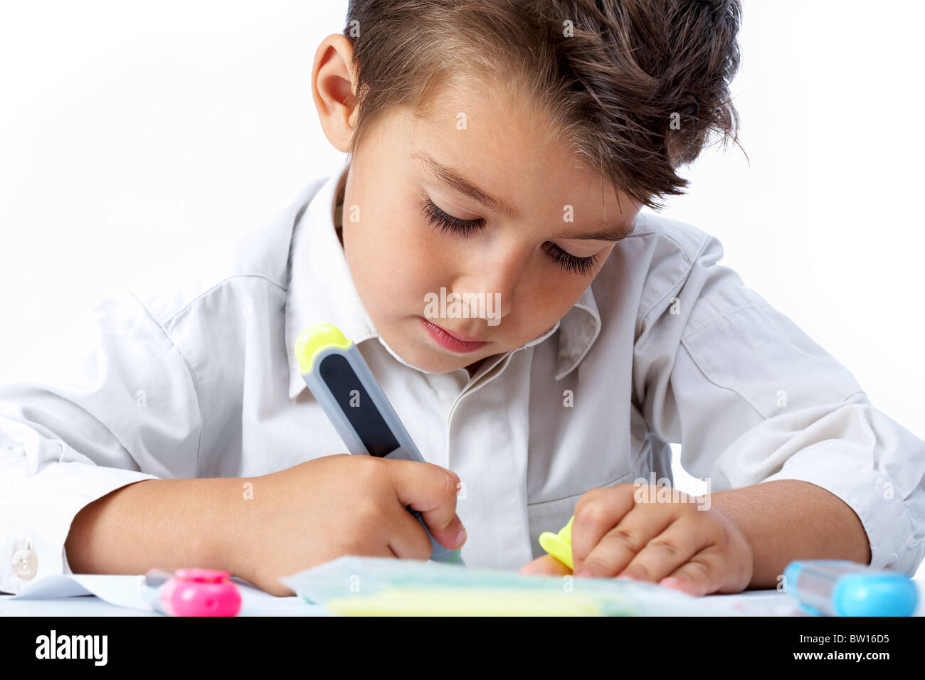 Portrait of school boy drawing something with highlighter Stock Photo ...