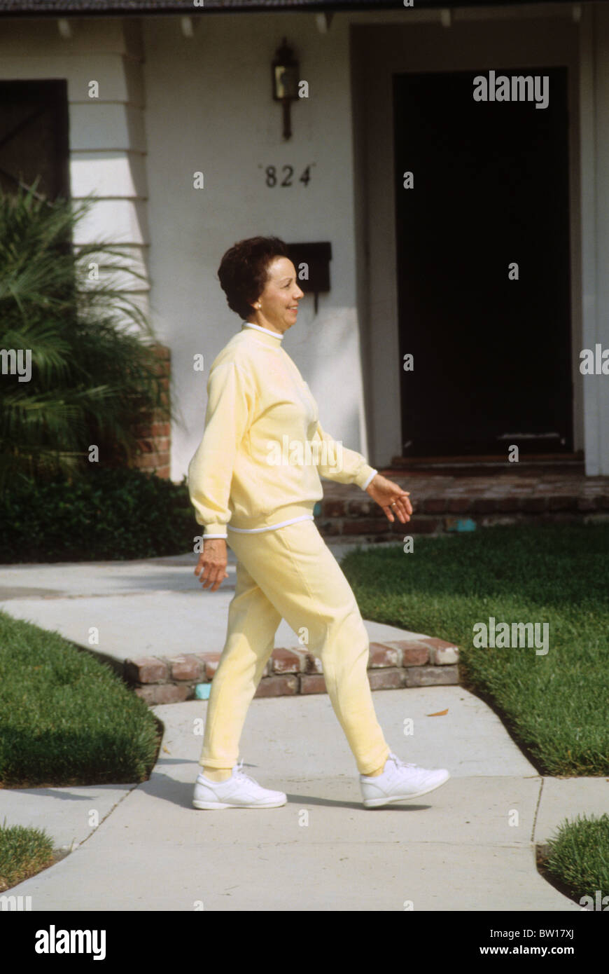 Hispanic woman female walk jog exercise move health sun fresh air body ...