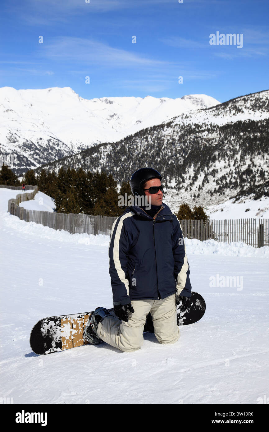 Snowboarder (man on 30s) waiting for his partner Stock Photo - Alamy