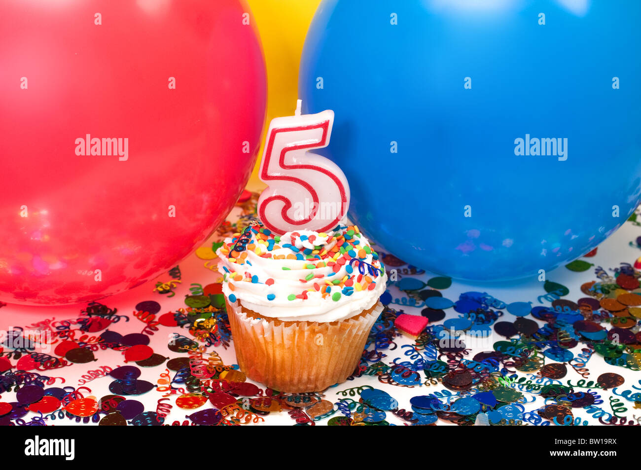 Celebration with balloons, confetti, cupcake, and number 5 candle Stock ...