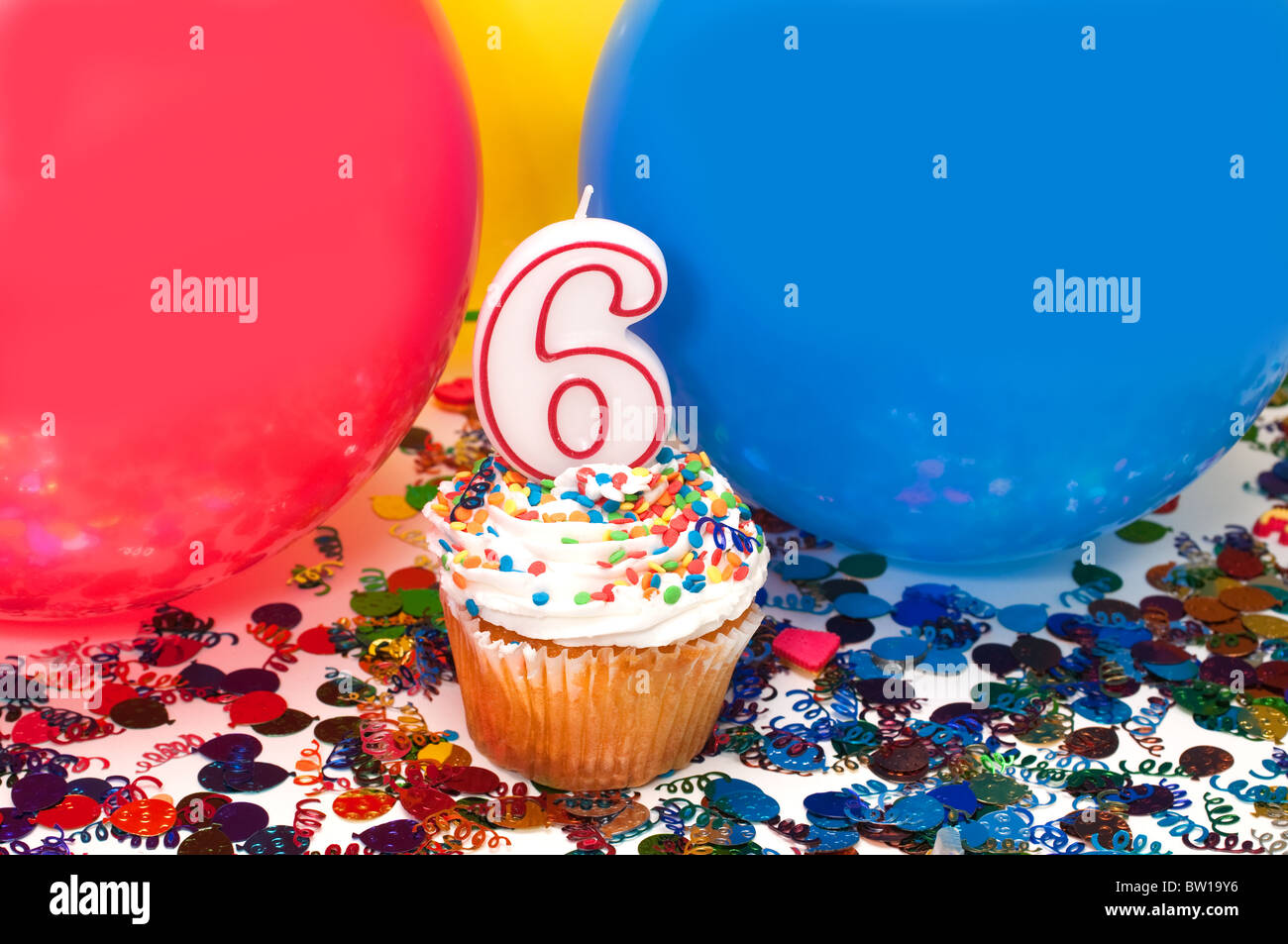 Celebration with balloons, confetti, cupcake, and number 6 candle Stock ...