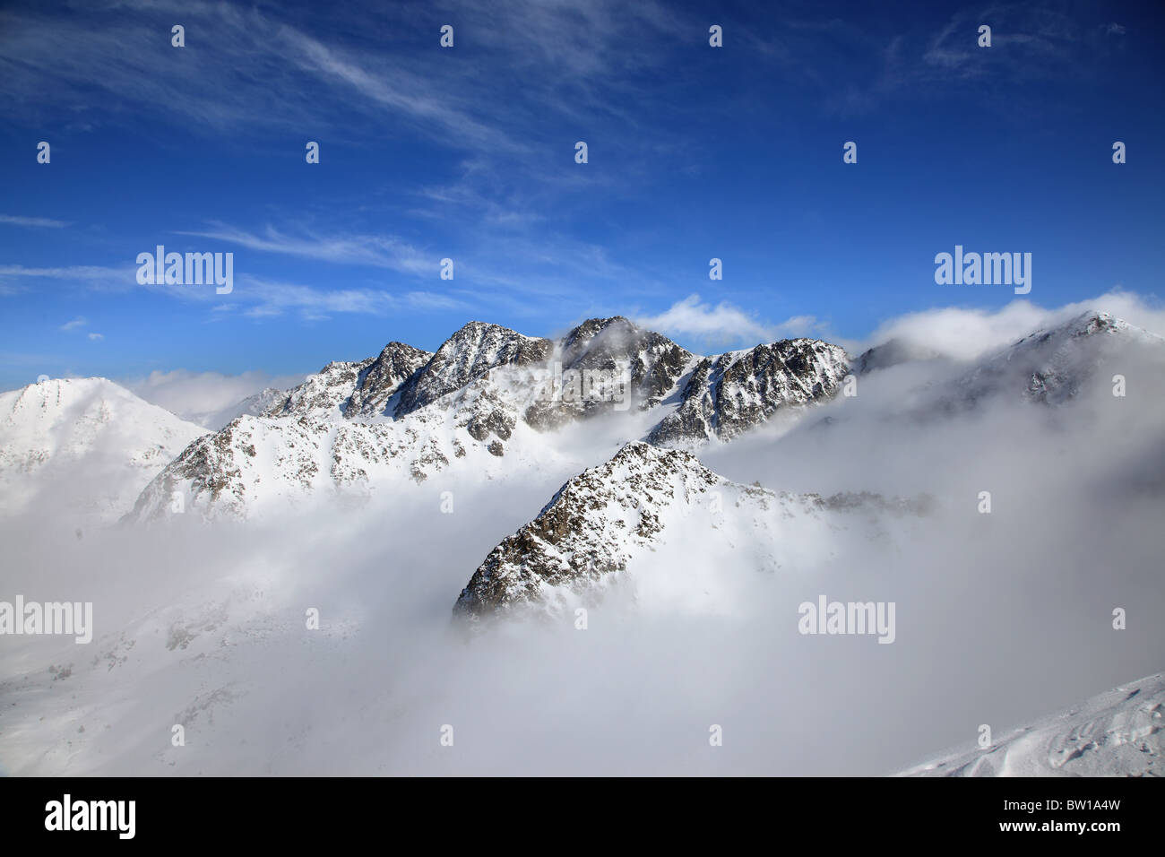 Mountain peak above clouds hi-res stock photography and images - Alamy