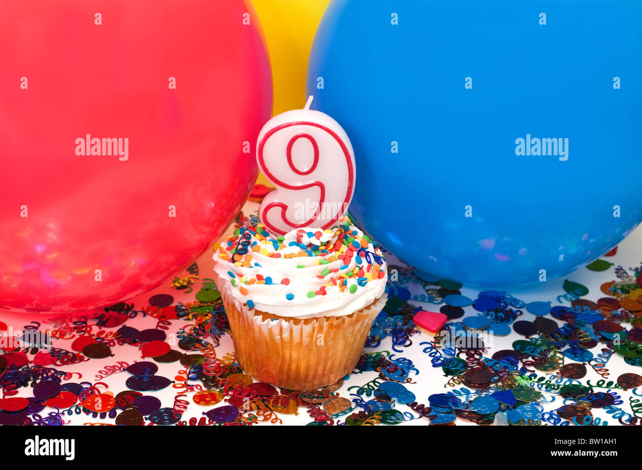Celebration with balloons, confetti, cupcake, and number 9 candle Stock ...