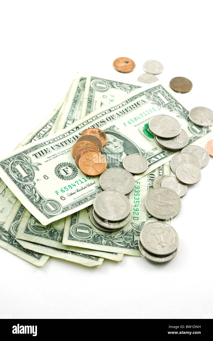American one dollar bills and several different American coins isolated ...