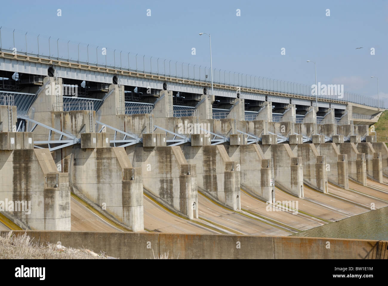 A dam on a lake with all gates closed restricting water flow Stock ...