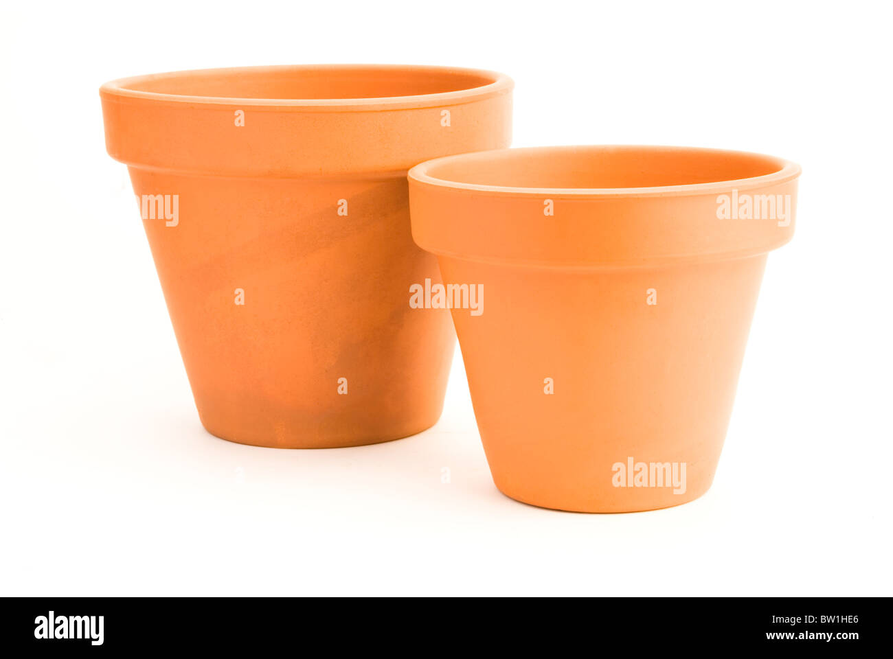two empty clay flower pots over white background Stock Photo - Alamy